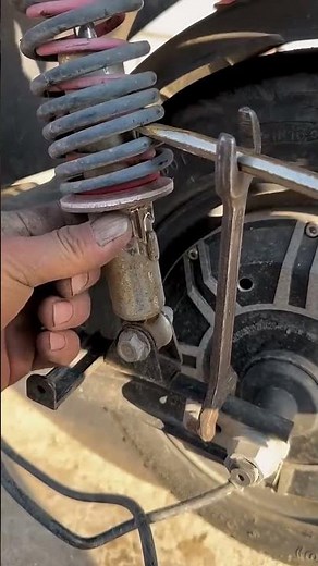 Shock-absorber spring adjustment process for the electric scooter