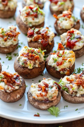 106K views · 1.9K reactions | This Stuffed Mushrooms Recipe is stuffed with the best flavors: cream cheese, parmesan, garlic, and crunchy bacon. | NatashasKitchen.com | Facebook