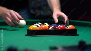 Racking the balls for the first break in pool game