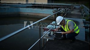 Environmental engineers work at wastewater treatment plants,Water supply engineering working at Water recycling plant for reuse