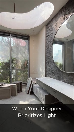 Studio Bipolar on Instagram: "This is what a bathroom feels like when natural light takes center stage. From the skylight above—lovingly nicknamed the amoeba—to the large windows that open out to the trees, every element is designed to invite the outdoors in. All day long, the space is washed in gentle, dappled sunlight, turning even the quietest moments into something magical. #BathroomDesign #NaturalLightInteriors #SkylightDesign #ArchitecturalDetails #LuxuryBathrooms #LightFilledSpaces #Dappl