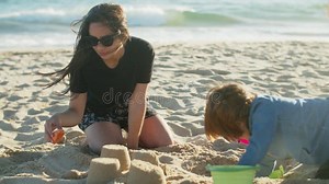 Focused Sisters and Little Brother Building Sand Castle on Beach Stock Footage - Video of girl, focused: 232976128