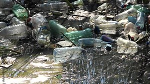 Pollution, Plastic Bottles in Mountain River, Garbage in Running Water, Trash Polluted, Polluting Nature, Global Warming Disaster