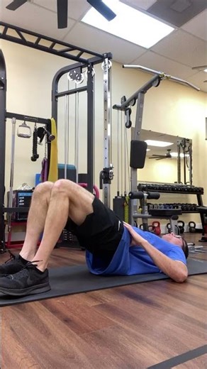 The floor bridge exercise for glute activation, core strength, and low back health