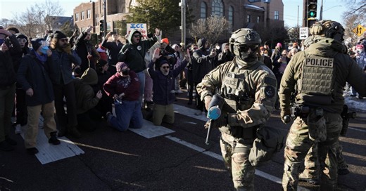 Federal immigration agents filmed dragging a woman from her car in Minneapolis