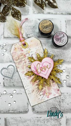 Annika Angberg Reinemann on Instagram: "💞 TINT YOUR MEDIUMS 💞 One of my favorite things about @lindysgang Magicals is how effortlessly they tint your mediums—perfect for dreamy, tone-on-tone layers. For this tag, I mixed Sparkle Texture Paste with Salt Water Taffy to give it a subtle vintage vibe. ✨ 💞 Salt Water Taffy and Steampunk Sepia Magicals, Lindy’s Gang 💞 Framed Tags, timholtz for @sizzix 💞 Texture Sparkle Paste and Black Archival Ink, Tim Holtz for Ranger Ink 💞 French Script backgr