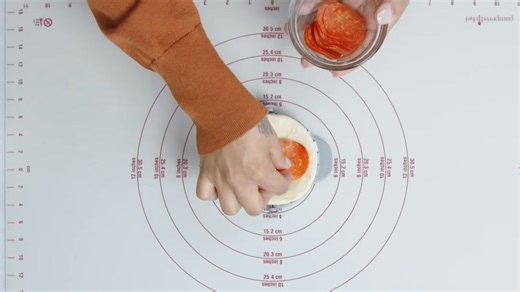 This tool makes hand pies, empanadas, dumplings, and more quickly and easily. The foldable base creates full or half pockets, while the top mold crimps and cuts uniform pies. The included spoon measures filling, and all parts nest for compact storage. #handpies #empanadas #dumplings #pocketmaker #baking | KQ PC Recipe Ideas