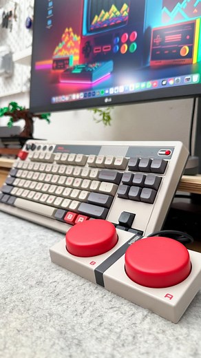 Nicco Gale on Instagram: "Retro keyboard anyone?🕹️ This Keeb from @8bitdo stole my heart!💜 It’s a 75% Keyboard (87 keys plus also the 2 big programmable ones 🔴🔴), it has the N-key rollover, aluminum plate, hot-swappable PCV, it mounts the “Kailh Box White Switches V2” which to me has quite of a clicky sound (and I like it this way, reminds me of the old Commodore 64 days…I know I’m old 🥲). It can work via Bluetooth, wireless or wired mode. It reminds me so much of my first Nintendo console