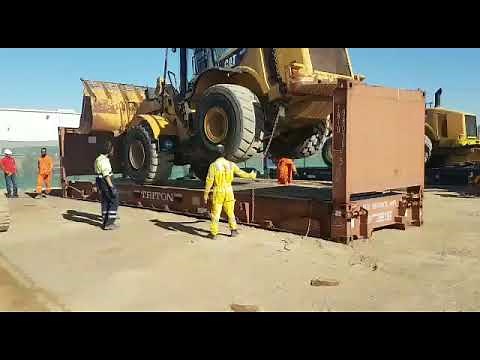 LOADING WHEEL LOADER INTO 40FT FLAT RACK SHIPPING CONTAINER