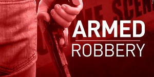 Police investigate an armed robbery at Springfield, Mo., convenience store