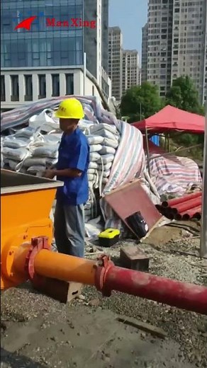 Concrete Mixing and Pumping Machine in Action at Bridge Construction Site