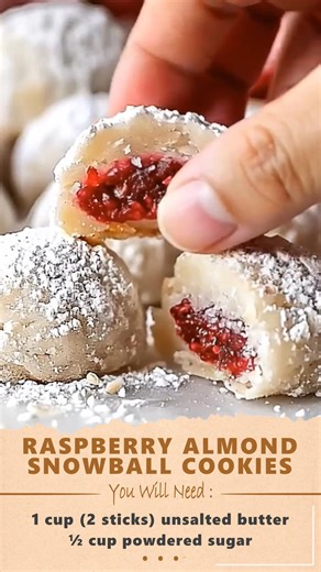 Raspberry Almond Snowball Cookies Ingredients 1 cup (2 sticks) unsalted butter, softened ½ cup powdered sugar (plus extra for coating) 1 tsp vanilla extract 2 ¼ cups all-purpose flour 1 cup finely ground almonds ¼ tsp salt ½ cup seedless raspberry jam Instructions Preheat oven to 350°F (175°C) and line a baking sheet with parchment. Cream the butter and powdered sugar until light and fluffy, then mix in vanilla. In another bowl, whisk together flour, ground almonds, and salt. Add dry ingredients