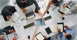 Business planning, proposal, and people at meeting table with multimedia technology for digital marketing analysis or analytics report. Proposal strategy collaboration of corporate workers from above