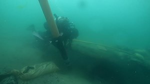 Divers explore pieces of HMS Invincible's protected shipwreck