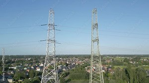 downward panning aerial shot replacement high-voltage electricity transmission lines poles movement view work being done from above infrastructure utility energy engineering industry