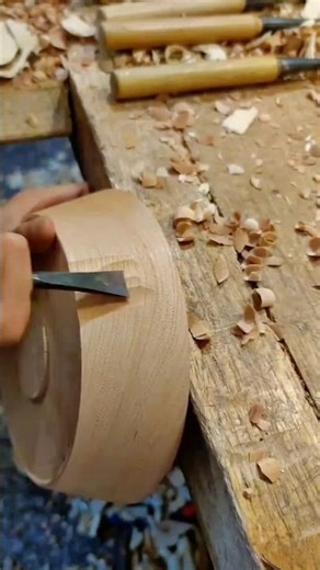 Traditional Woodworking Skills Using Manual Chisel for Carving Details on Wooden Bowls