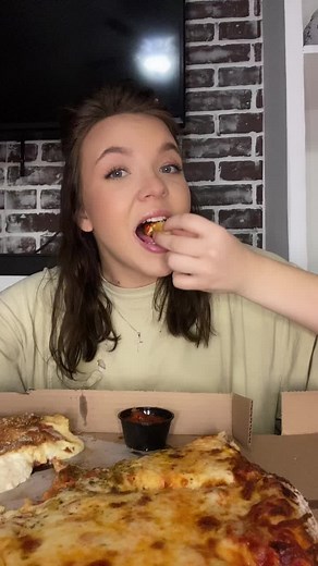 Enjoying Cheese Pizza with Dipping Sauce
