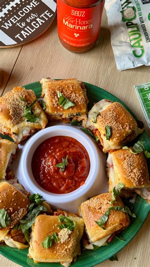 The Big Game is fast approaching and we’re all about the apps (and the halftime show, duh) 🤤🍔🐓 - these Chicken Parm Sliders come together with just a few simple ingredients and are perfect for your watch party 🏈 Here’s how to make them (recipe inspired by @tasteofhome): Ingredients: -2 14 oz bags of CAULIPOWER Original Chicken Tenders -1 jar SAUZ Hot Honey Marinara -1 package (12 ounces) rolls of choice -14 slices provolone cheese, divided -1/2 cup butter, cubed -1 teaspoon garlic powder -1 