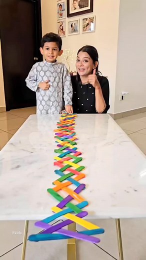 Best Kids Activities on Instagram: "DIY Explosive Fun! Try This Popsicle Stick Chain Reaction 🚀 ( cc @vandita.momandmore )⠀ ⠀ This activity uses popsicle sticks woven together in a chain pattern to create stored energy. As each stick bends, it builds tension in the wood fibers. When the last stick is released, the stored energy rapidly converts into kinetic energy, causing a chain reaction where the sticks fly into the air. It’s a fun, hands-on way to explore the science of potential and kineti