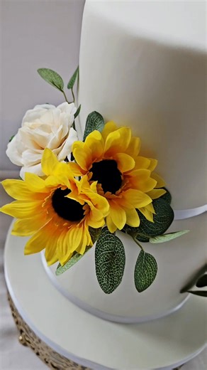A touch of sunshine 🌻 I just had to share this gorgeous two-tier wedding cake, decorated with beautiful sunflowers. They're fast becoming one of the most popular choices for weddings, and it's easy to see why! They ooze sunshine, joy, and put a smile on everyone's face. If you're planning your dream wedding here in Lincolnshire, follow me for more elegant wedding cake designs, ideas, and behind-the-scenes moments from my kitchen. | Pilgrim Cottage Cakes