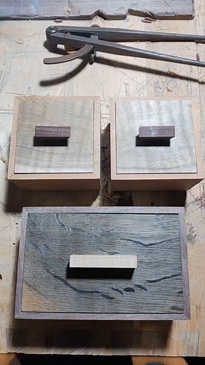 A matching pair of boxes, with bookmatched curly maple lids, and identical fabric interiors, and a walnut box with a French Oak top and cherry bottom, ready for finish. #boxes #boxmaking #woodworking | Glenn Lewis