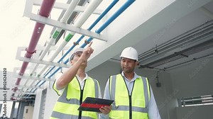 Two engineers in safety gear inspecting piping systems on a rooftop, focusing on maintenance, technical expertise, and construction planning in an urban environment.