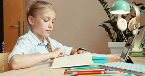 Student girl 8 aged falling asleep when reading textbook