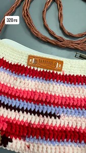 DM to Buy 👆🏻 Handmade Crochet Sling Bag – ₹320 Shipping A beautifully handcrafted crochet sling bag featuring vibrant multicolour stripes in red, pink, cream, maroon, and soft lavender. The bag includes: ✨ Size: Approximately 8” × 5” ✨ Secure white zipper closure ✨ Braided long sling strap for comfortable crossbody use ✨ Cute faux-leather leaf tassels for added charm ✨ Handmade tag label on the front ✨ Perfect for daily use, gifting, and carrying your little essentials #crochetbags #crochetpou