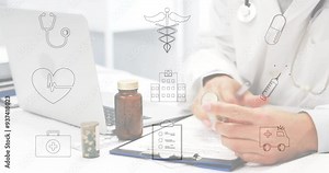 Medical icons animation over doctor working with laptop and medication on desk