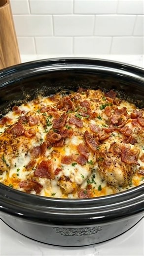 Slow Cooker 3-Ingredient Crack Chicken Recipe Ingredients 2 pounds boneless, skinless chicken breasts (or thighs) 1 (8-ounce) block cream cheese, cut into large cubes 2 tablespoons dry ranch seasoning mix (store-bought packet or homemade) Directions Place the chicken in an even layer on the bottom of the slow cooker. If you’re using both breasts and thighs, mix them together so they cook evenly. Sprinkle the dry ranch seasoning mix evenly over the chicken, making sure most of the surface is ligh