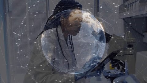 clip-3993977195-scientist-placing-slide-focusing-microscope-lab-digital