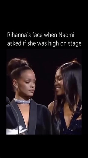 Real History on Instagram: "The moment became iconic because of how instantly Rihanna’s face told the whole story when Naomi Campbell jokingly asked on stage if she was high. Rihanna’s expression shifted into a mix of mock offense, disbelief, and barely contained laughter—eyes widening, lips tightening, like she was thinking, “Did you really just say that?” Instead of snapping or denying it outright, she let the look linger, which made the crowd react even harder. That split-second reaction turn