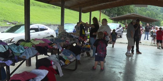 Motorcycle club gives away school supplies, clothes