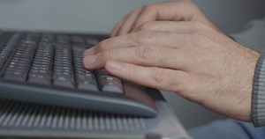clip-1046086375-man-works-computer-male-hands-on-keyboard