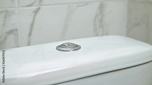 Man With green Glove on Hand Push Basin Mechanism Button for Toilet Water Flush