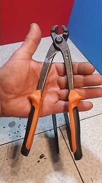 PLIERS WITH CUTTER HANDLES AND RETURN SPRING.
