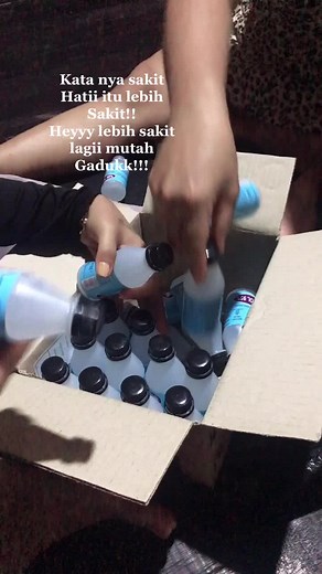 Packing Blue-Labeled Beverage in Cardboard Boxes