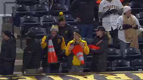 A Pirates employee running in the background with a cone on her headA family of conesA cone costumeTHE CONE HAS BEEN HOISTED