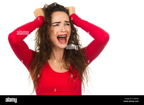 A Very Frustrated And Angry And Upset Woman Is Screaming Out Loud And Pulling Her Hair Isolated