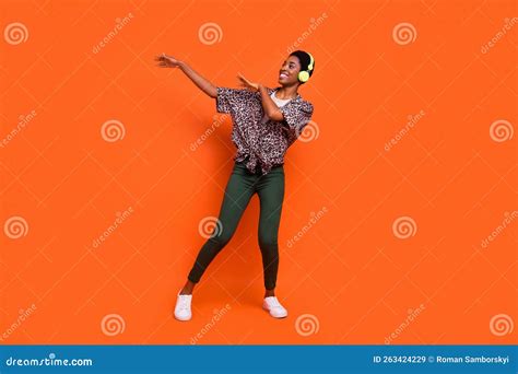Full Length Body Size View Of Attractive Cheerful Trendy Girl Listening Melody Dancing Over