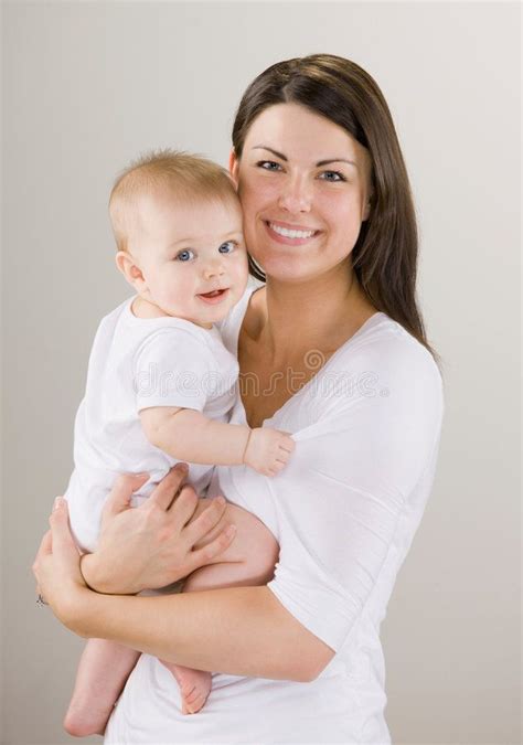 Loving Mother Holding Baby Studio Shot Of Loving Mother Holding Baby