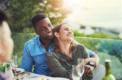 Happy Dinner And Interracial Couple Hug Outdoor With Love Care And Bonding At Party At Sunset