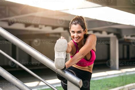 Fitness Sport Exercising And Lifestyle Concept Close Up Of Couple Stretching Leg On Stands