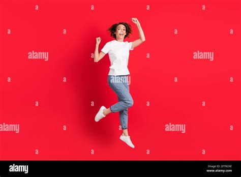 Full Length Body Size View Of Attractive Cheerful Skinny Girl Jumping Rejoicing Isolated Over