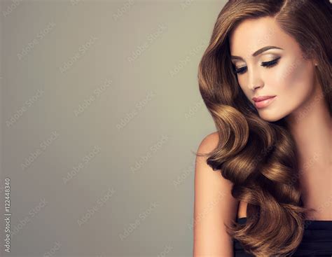 Beautiful Model Girl With Long Wavy And Shiny Hair Brunette Woman With Curly Hairstyle Stock