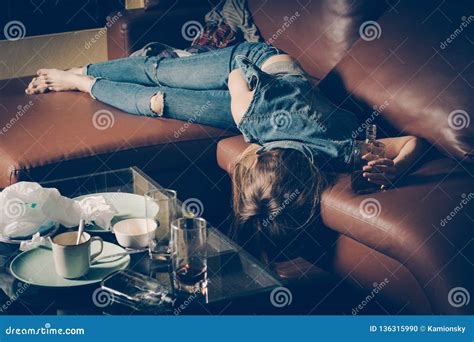 Young Drunk Woman On The Sofa Young Drunk Woman On The Sofa Alcoholism And Drug Addiction Lead