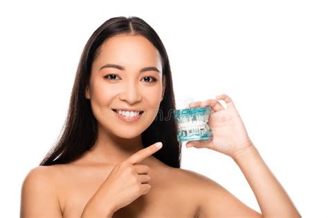 Naked Asian Woman Pointing With Finger At Jaw Model Isolated On White