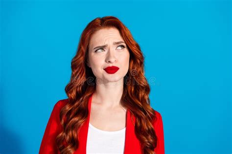 Photo Of Minded Confused Gorgeous Girl Wear Red Trendy Clothes Look Empty Space On Blue Color