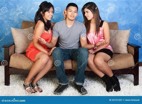 Young Man With Two Ladies Stock Image Image Of Playing 25121257