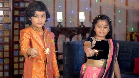 Indian Brother And Sister Teasing Each Other While Sitting Together On A Couch Stock Footage